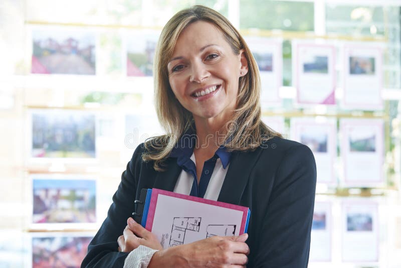 Portrait of Female Estate Agent in Office Stock Image - Image of ...