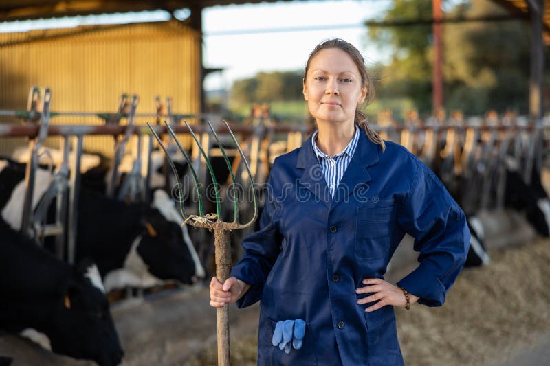 Portrait of Female Farm Owner in Cowshed Stock Photo - Image of breeder ...