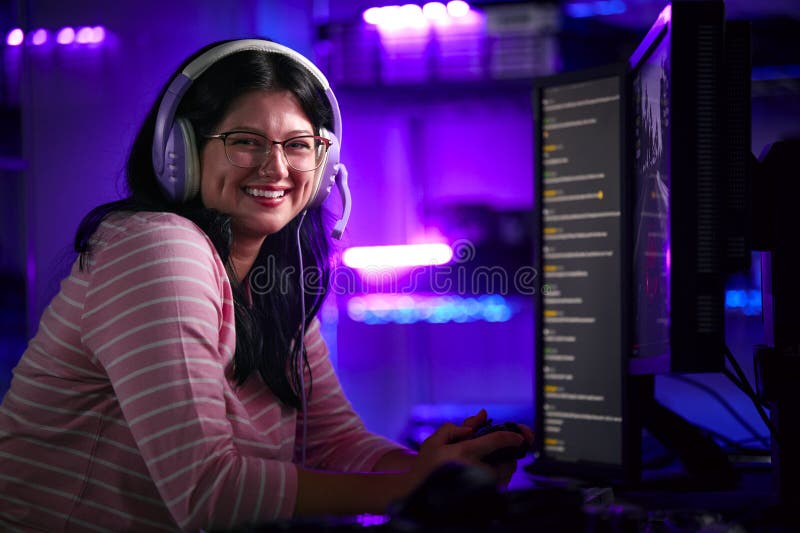 Portrait of Female Gamer in Front of Computer Screens with Headphones ...