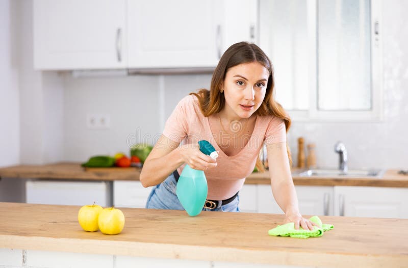 Portrait of Female Houseworker Dusting Kitchen Surfaces Stock Image ...