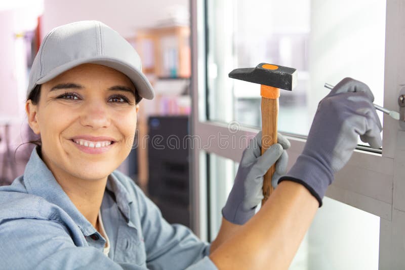 Portrait Female Locksmith Using Hammer Stock Image - Image of portrait ...