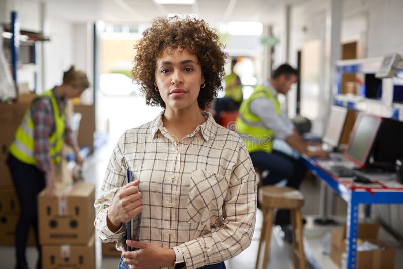 Portrait of Female Manager in Logistics Distribution Warehouse Using ...