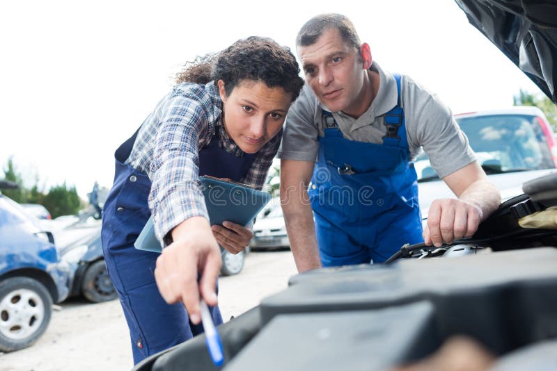 Portrait Female Mechanic Pointing at Issue Outdoors Stock Photo - Image ...