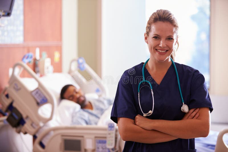 Portrait of Female Nurse with Patient in Background Stock Photo - Image ...