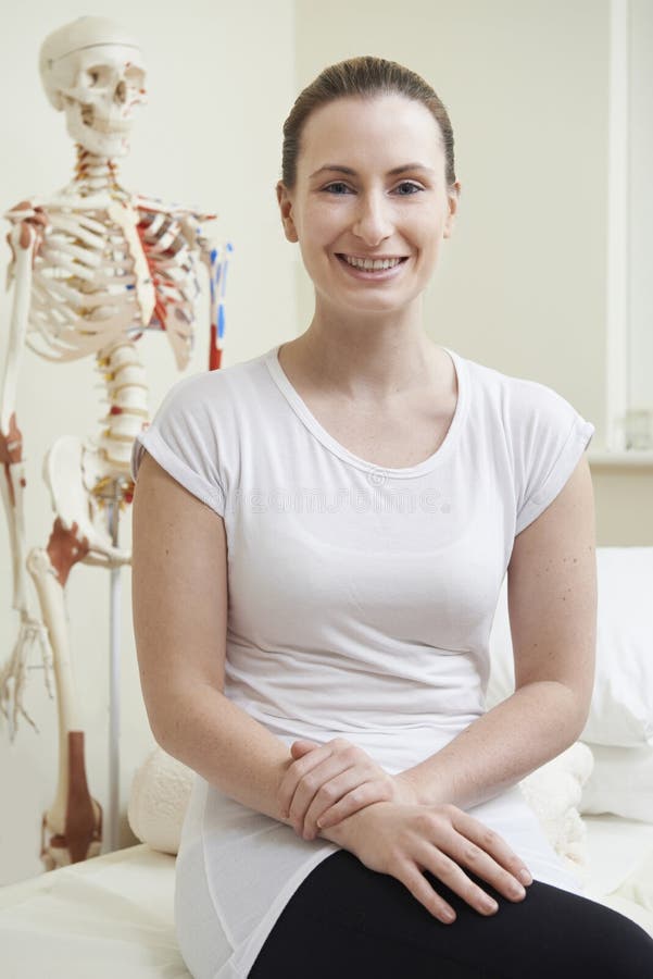 Portrait of Female Osteopath in Consulting Room Stock Photo - Image of ...