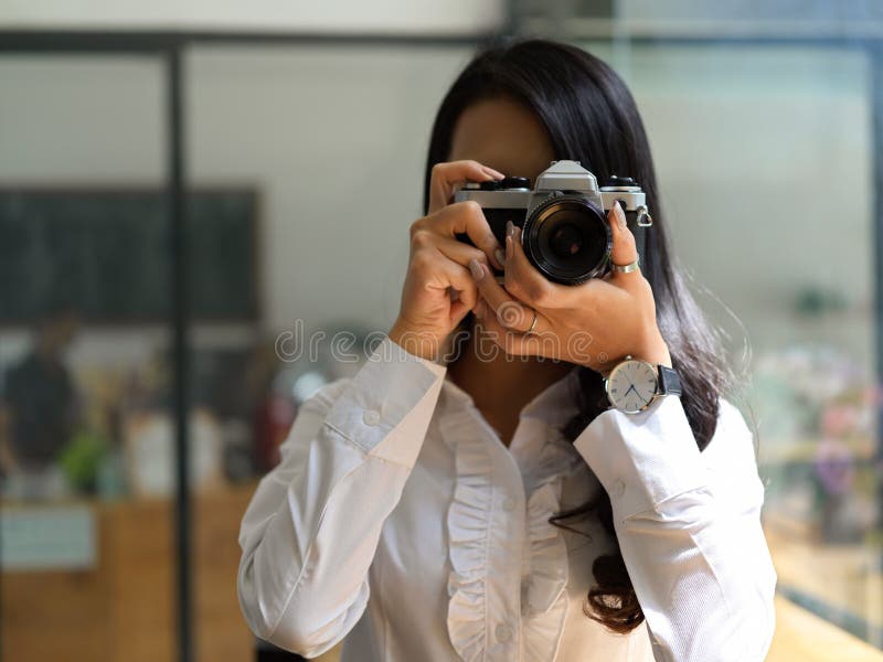 Female Photographer Taking Photo with Camera in Studio Stock Image ...