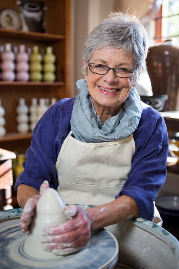 Portrait of Female Potter Making Pot Stock Photo - Image of camera ...