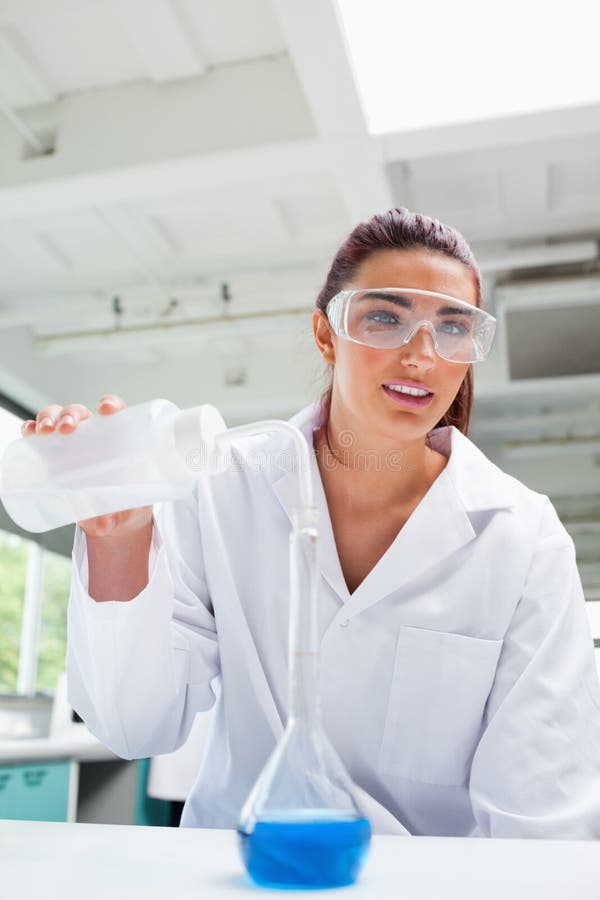 Female Science Student Looking at a Test Tube Stock Image - Image of ...