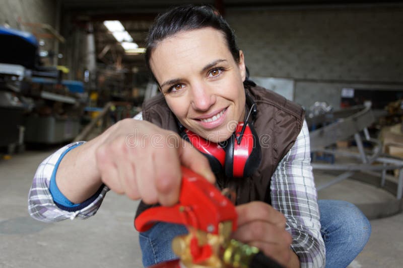 Portrait Female Staff Smiling while Standing in Warehouse Stock Photo ...