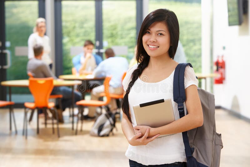 Portrait of Female Student in Classroom with Digital Tablet Stock Photo ...
