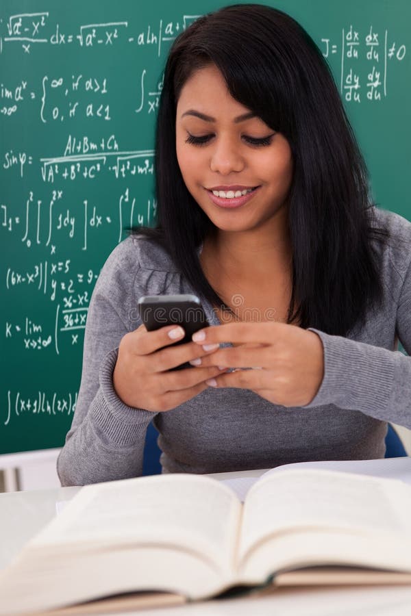 Portrait of Female Student Using Cell Phone Stock Image - Image of ...
