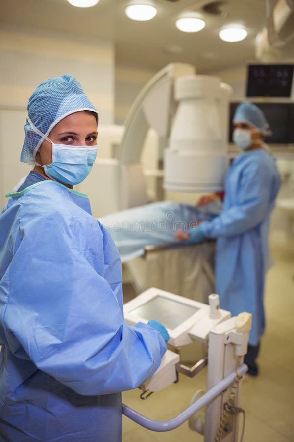 Portrait of Female Surgeon Using Machine in Operation Theater Stock ...