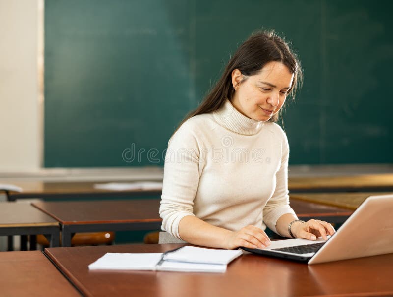 Portrait of Female Teacher Using Laptop Stock Image - Image of study ...
