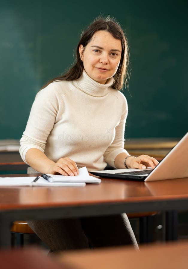 Portrait of Female Teacher Using Laptop Stock Photo - Image of european ...