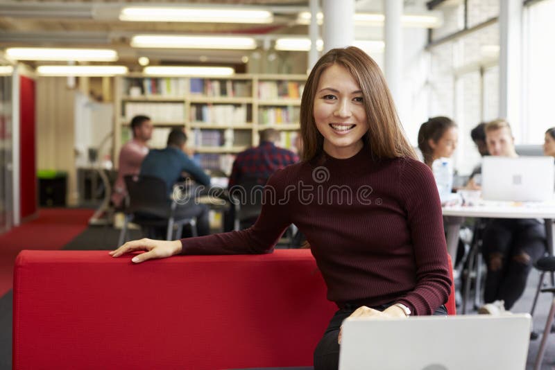 Portrait of Female University Student Working in Library Stock Photo ...