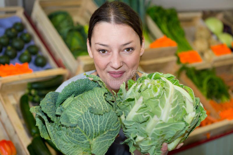 Portrait Female Vendor Holding Cabbage Stock Image - Image of green ...