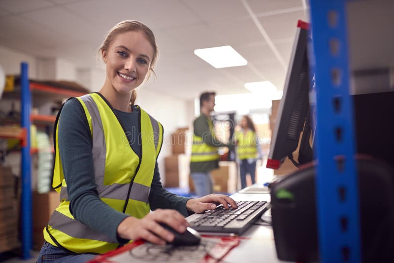 Portrait of Female Worker in Busy Modern Warehouse Working on Computer ...