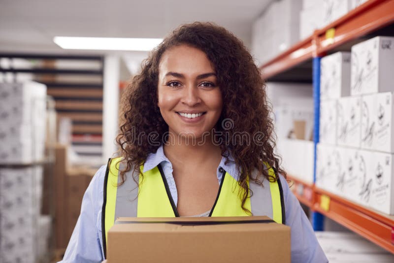 Portrait of Female Worker Holding Box Inside Warehouse Stock Image ...