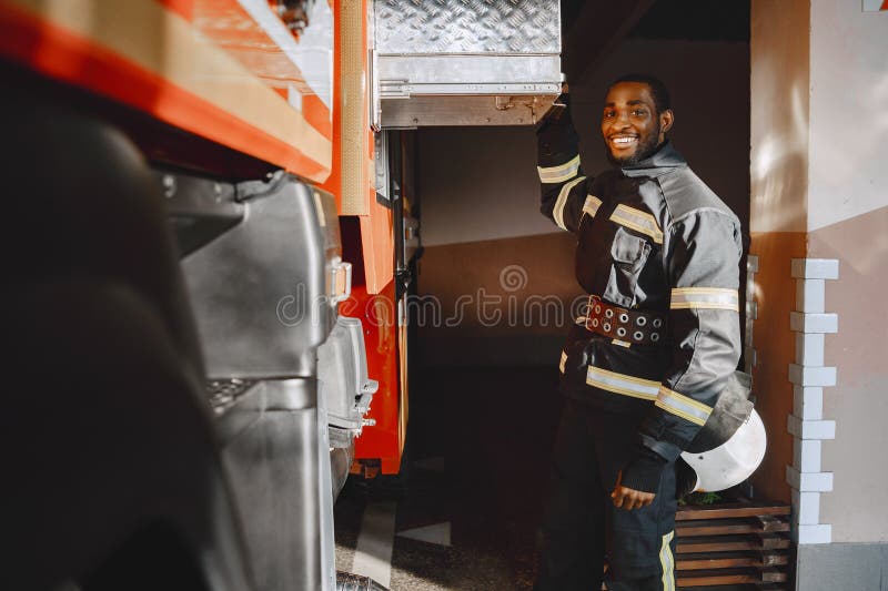 Portrait of a Firefighter Standing in Front of a Fire Engine Stock ...