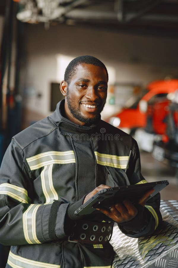 Portrait of a Firefighter Standing in Front of a Fire Engine Stock ...