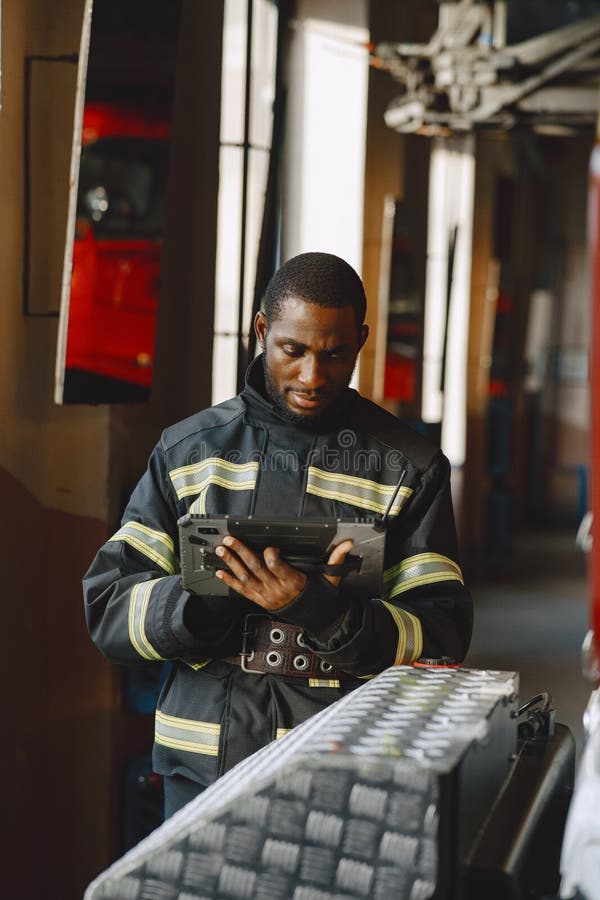 Portrait of a Firefighter Standing in Front of a Fire Engine Stock ...