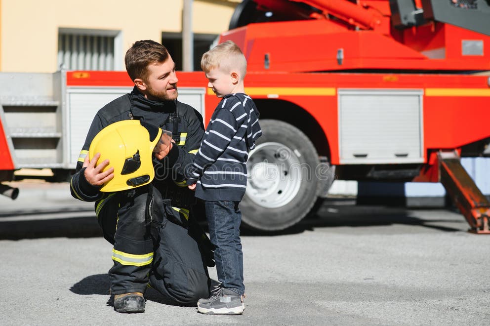 Portrait of a Firefighter Standing in Front of a Fire Engine Stock ...
