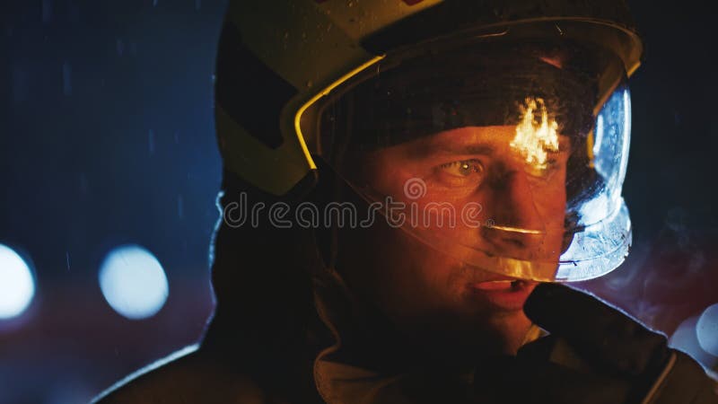 Portrait of the Fireman in Full Uniform during the Night Rain Stock ...