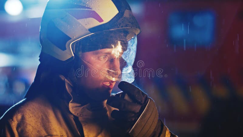 Portrait of the Fireman in Full Uniform during the Night Rain Stock ...