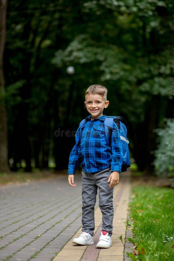 Portrait of a First Grader with a Backpack. the Boy Goes To School ...