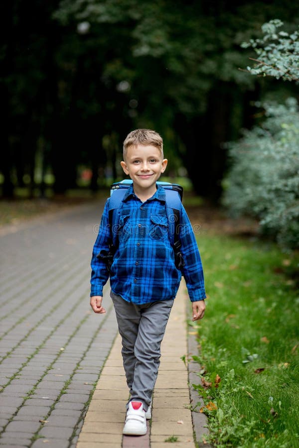 Portrait of a First Grader with a Backpack. the Boy Goes To School ...