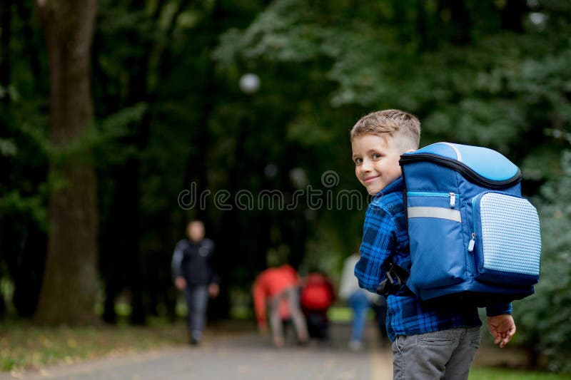 Portrait of a First Grader with a Backpack. the Boy Goes To School ...