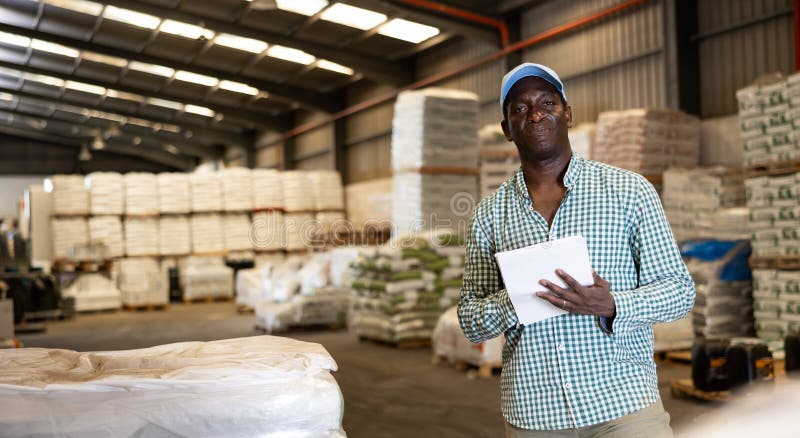 Portrait of Focused African-American Man Checking Order List Stock ...