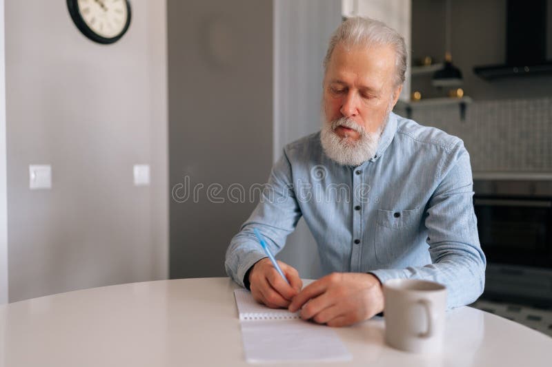 Portrait of Focused Grey Haired Senior Older Man Writing Making Notes ...