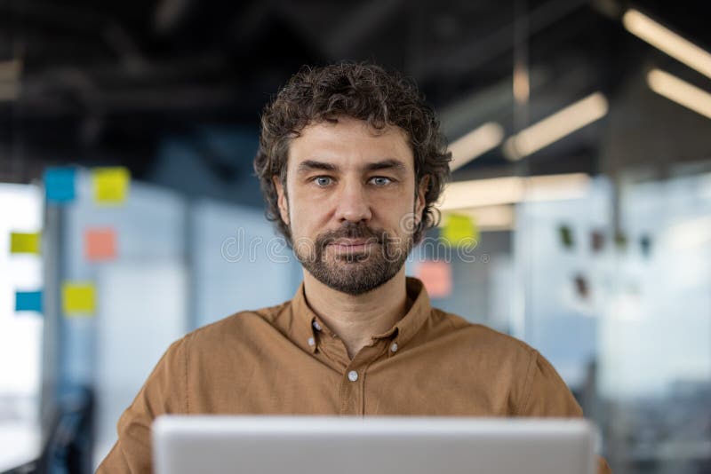 Confident Hispanic Businessman Looking at Camera in Office Stock Photo ...