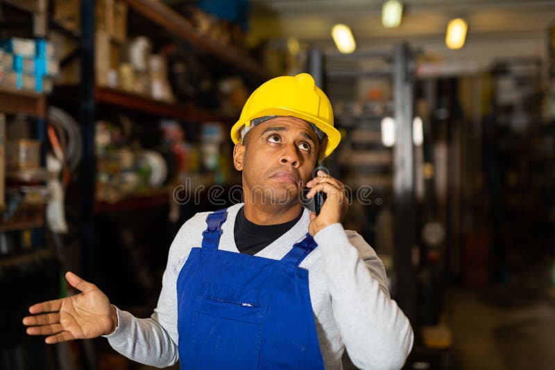Focused Worker of Building Materials Warehouse Talking on Phone Stock ...