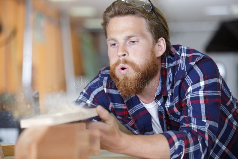 Portrait Focused Modern Carpenter Blowing Sawdust Off Workstation Stock ...
