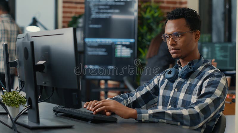 Portrait of Focused Programer Writing Code Fixing Glasses and Smiling ...