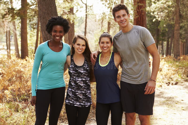 Portrait of Four Runner Friends in a Forest Stock Photo - Image of ...