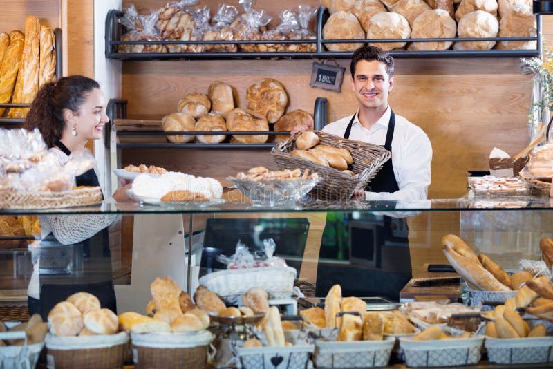 Portrait of Friendly Cheerful Couple at Bakery Display Stock Image ...