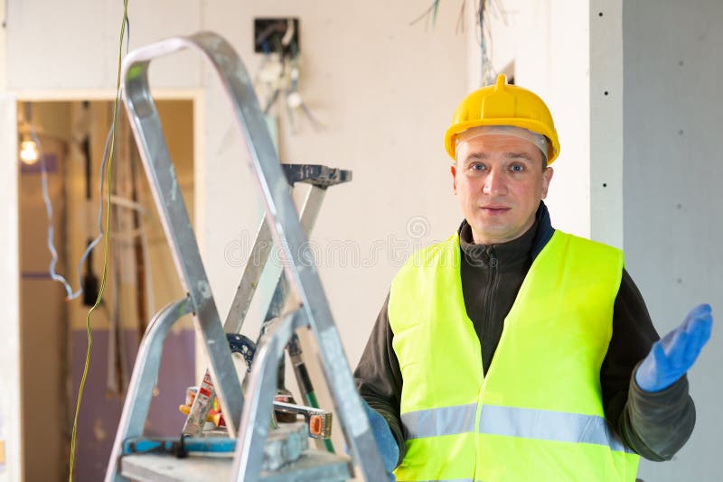 Portrait of Friendly Construction Worker Standing at Indoors Building ...