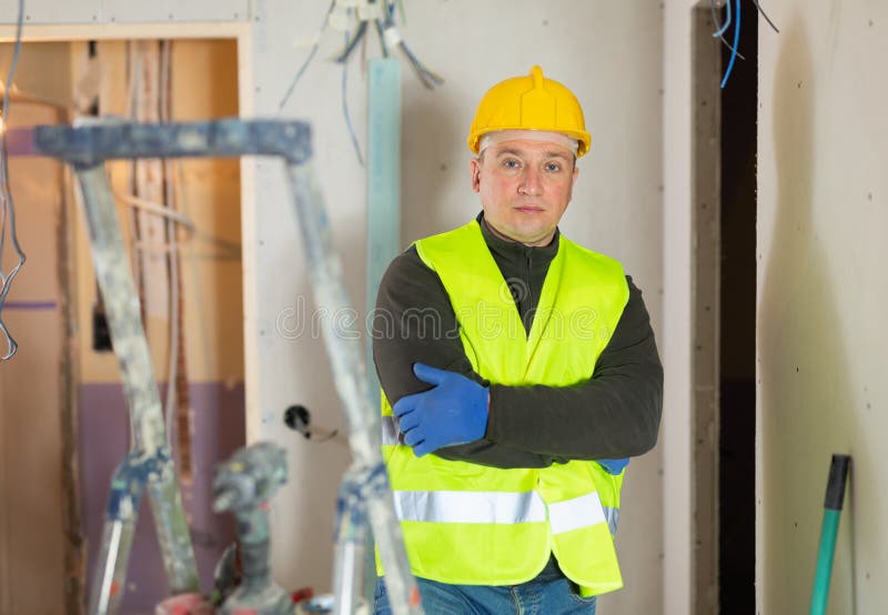 Portrait of Friendly Construction Worker Standing at Indoors Building ...