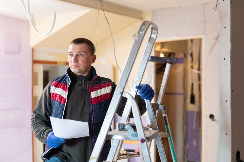 Portrait of Friendly Construction Worker Standing at Indoors Building ...