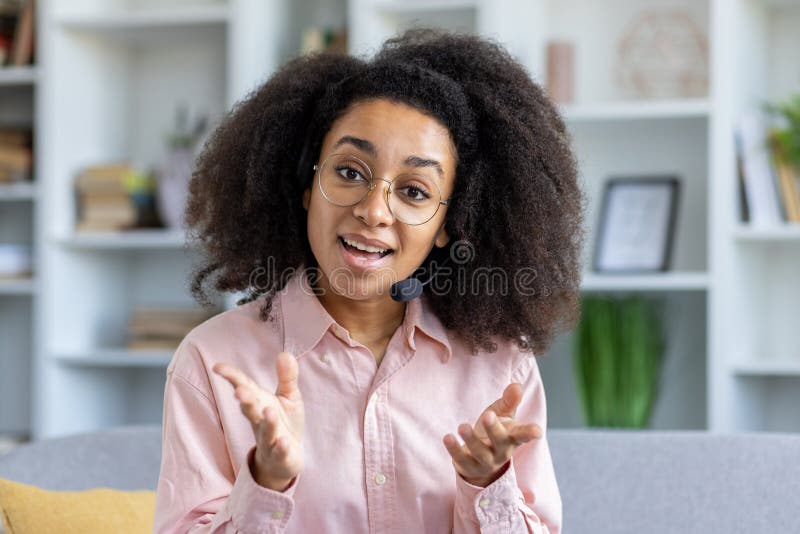 Smiling Customer Service Representative Using a Headset while Talking ...