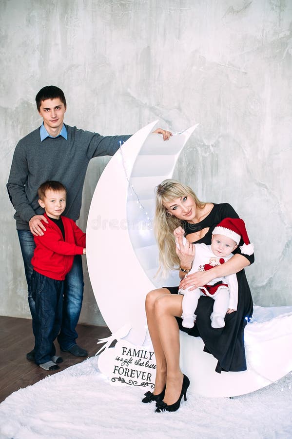 Portrait of Friendly Family Looking at Camera on Christmas Evening ...