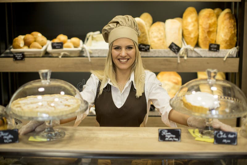 Portrait of Female Baker with Fresh Bread Smiling in Bakery Stock Photo ...