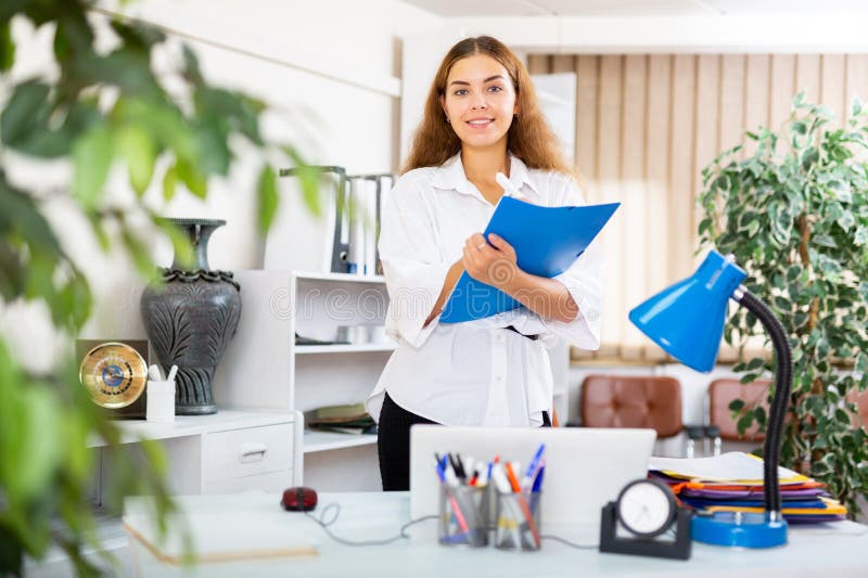 Friendly Female Administrative Secretary Writing Down Tasks in Office ...