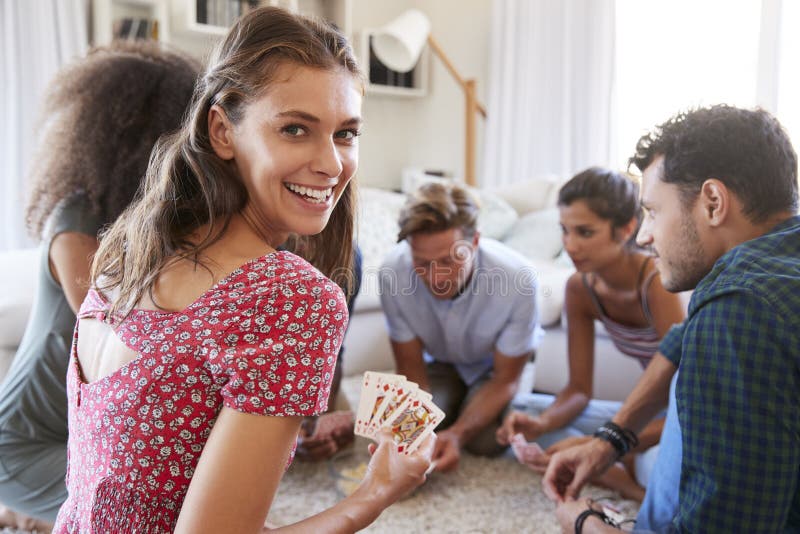 Portrait of Friends at Home Playing Cards Together Stock Image - Image ...
