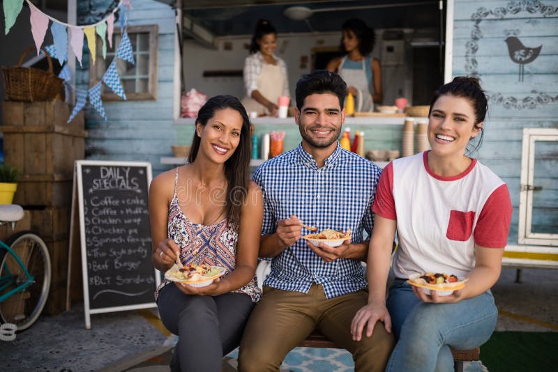 Portrait of Friends Sitting with Snacks Stock Photo - Image of ...