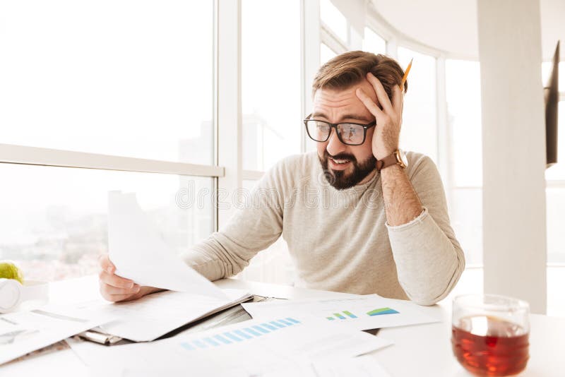 Portrait of a Frustrated Man Working with Documents Stock Photo - Image ...