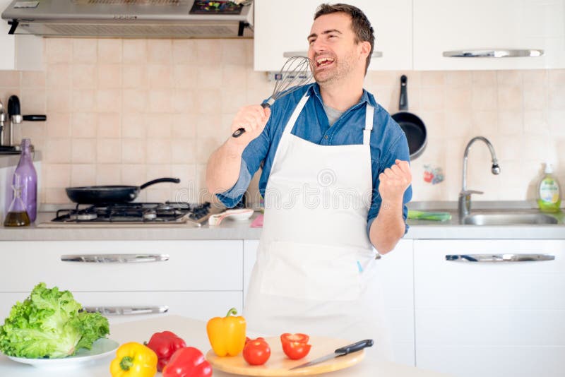 Portrait of Funny Man Cooking and Singing in the Kitchen Stock Image ...
